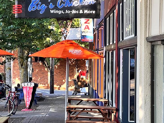 The bright red exterior with vibrant orange umbrellas isn't just eye-catching&mdash;it's nature's way of signaling something delicious awaits inside. 
