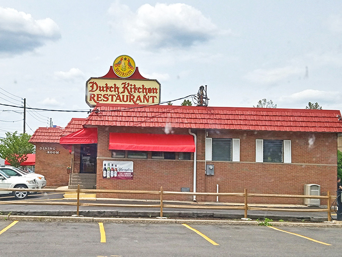 The iconic red-roofed Dutch Kitchen stands like a beacon of comfort food promise, complete with spring tulips that seem to bow in culinary reverence. 