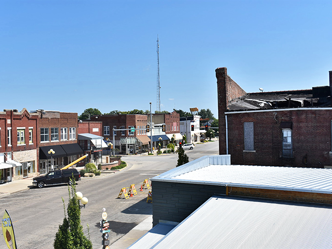 Downtown Casey welcomes you with classic Midwest charm, red brick buildings standing proud against blue skies like sentinels of small-town hospitality.