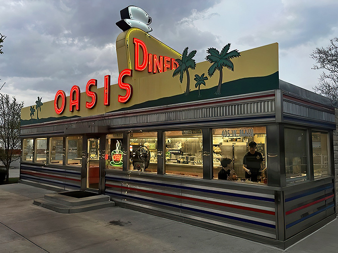 The sunshine-yellow facade of Oasis Diner gleams like a beacon of hope for hungry travelers. This isn't just a restaurant&mdash;it's a time machine with french fries.