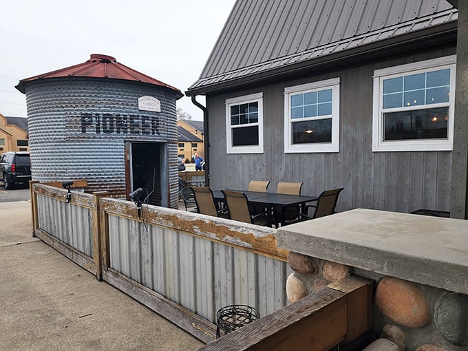 The barn-like facade of The Chubby Trout stands proud with its distinctive silo structure and weathered gray exterior. Rustic charm meets culinary adventure in this unassuming roadside treasure.