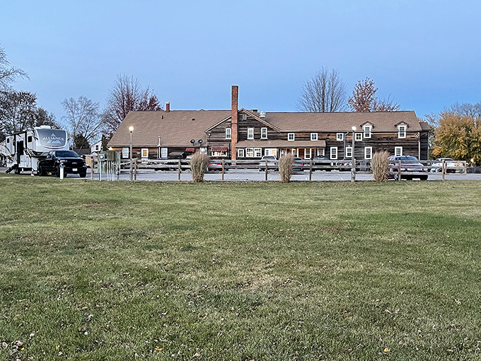 The weathered wooden exterior of Millstream Brau Haus stands like a time capsule from old-world Germany, miraculously transported to the Iowa countryside.