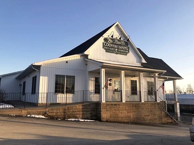 The white clapboard facade of Breitbach's stands like a beacon of comfort food, hanging flower baskets swaying in the Iowa breeze.