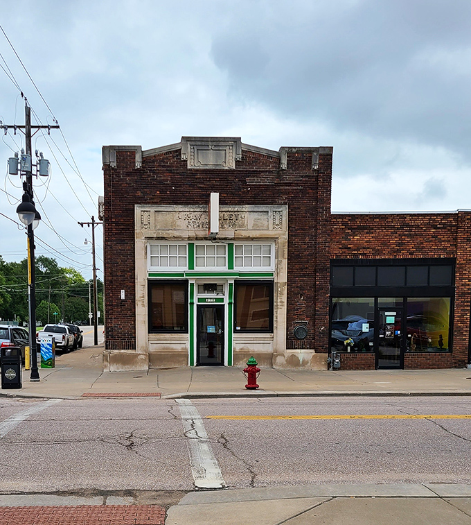 The historic brick building housing Bradley's Corner Cafe stands proudly in North Topeka, its green-trimmed entrance beckoning hungry patrons like a culinary lighthouse.