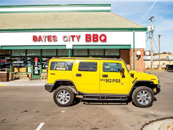 The unassuming storefront of Bates City BBQ, where stacked firewood isn't decor&mdash;it's a promise of smoky delights waiting inside.