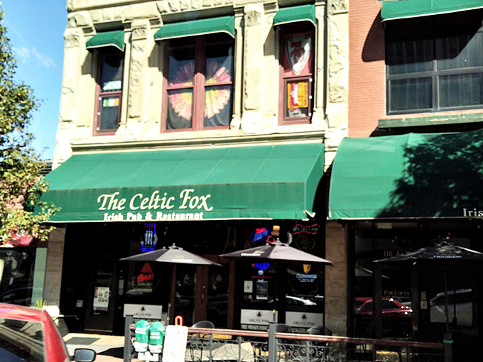 The Celtic Fox's emerald-green awnings stand out like a beacon of Irish hospitality on Topeka's historic downtown strip. Architecture that whispers "come in for a pint."