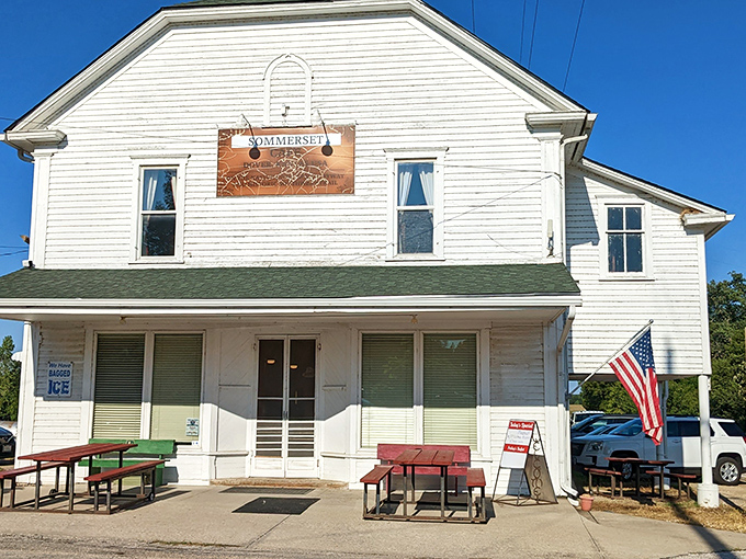 The white clapboard exterior with its cherry-red door isn't trying to impress anyone, which is exactly why it's so impressive. Small-town Kansas perfection.