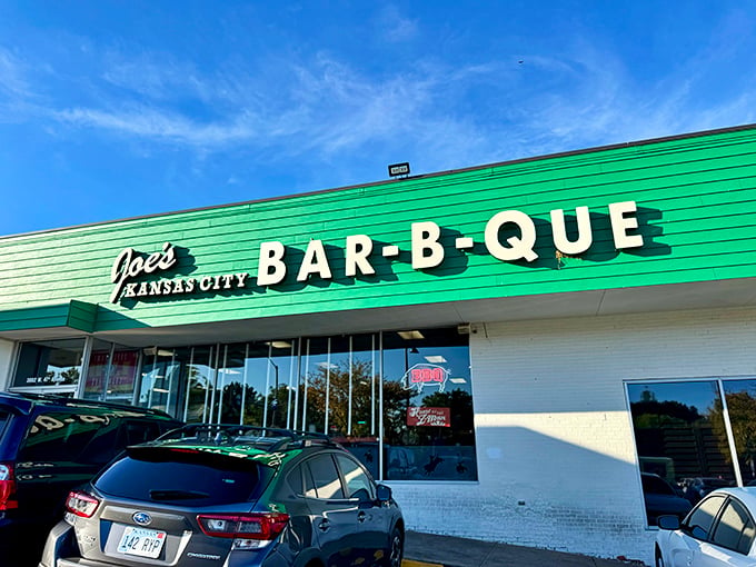 The iconic green exterior of Joe's Kansas City Bar-B-Que stands as a beacon of hope for hungry travelers&mdash;proof that extraordinary food often hides in ordinary places.