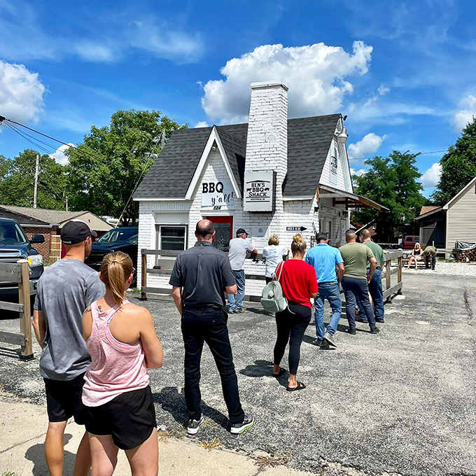 The white brick cottage with its distinctive red door isn't just serving barbecue &ndash; it's serving dreams wrapped in smoke and tucked between bread.