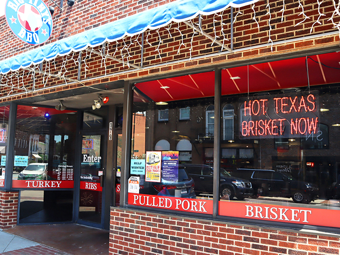 The neon "OPEN" sign at Big Tiny's isn't just an invitation&mdash;it's a siren call to barbecue pilgrims. Those colorful string lights aren't decorations; they're beacons of smoked meat salvation.