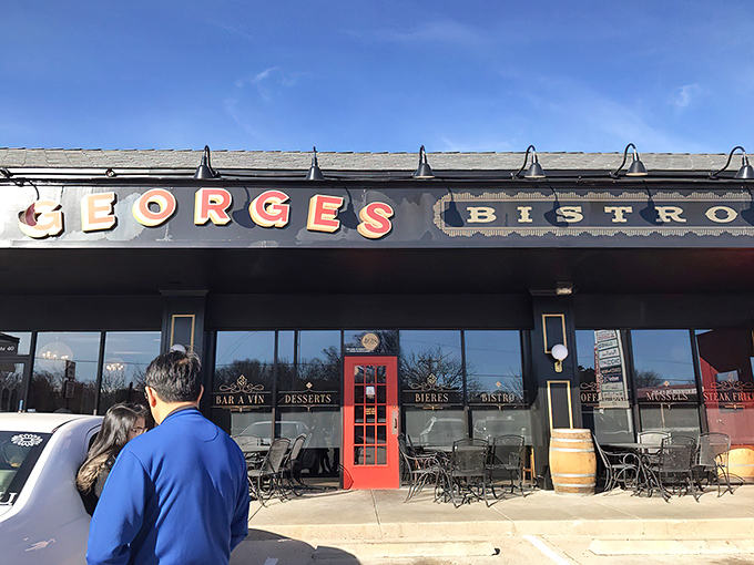 The black and gold fa&ccedil;ade of Georges French Bistro stands proudly against the Kansas sky, promising Parisian delights with Midwestern hospitality.