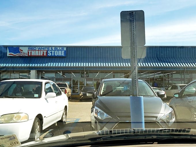 The patriotic facade of Red White & Blue Thrift Store stands like a treasure chest waiting to be opened, promising adventures in secondhand splendor under the Louisiana sun. 