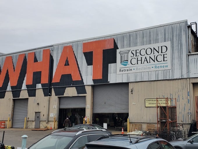 The unmistakable exterior of Second Chance announces itself with bold orange lettering that practically screams "treasures inside!" No subtle antique shop vibes here. 