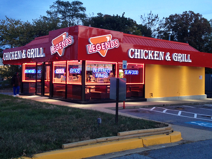 The neon glow of Legends beckons like a lighthouse for the hungry, promising salvation in the form of perfectly fried chicken as dusk settles over Hyattsville.