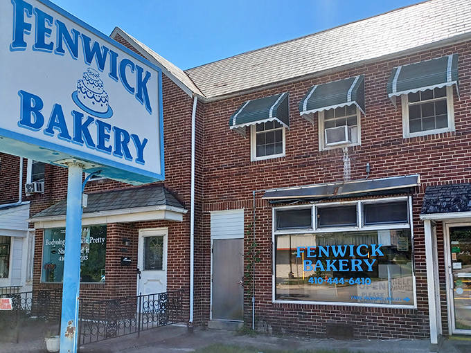 The classic brick exterior of Fenwick Bakery stands as Baltimore's sweet landmark since 1913, complete with those charming green awnings that practically whisper "come inside."