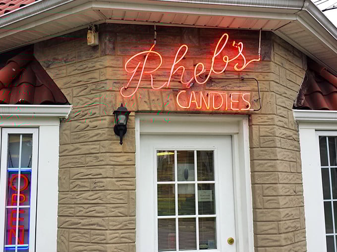 That glowing neon sign isn't just advertising candy—it's a beacon of sweetness that's been guiding Baltimoreans to chocolate bliss for generations.