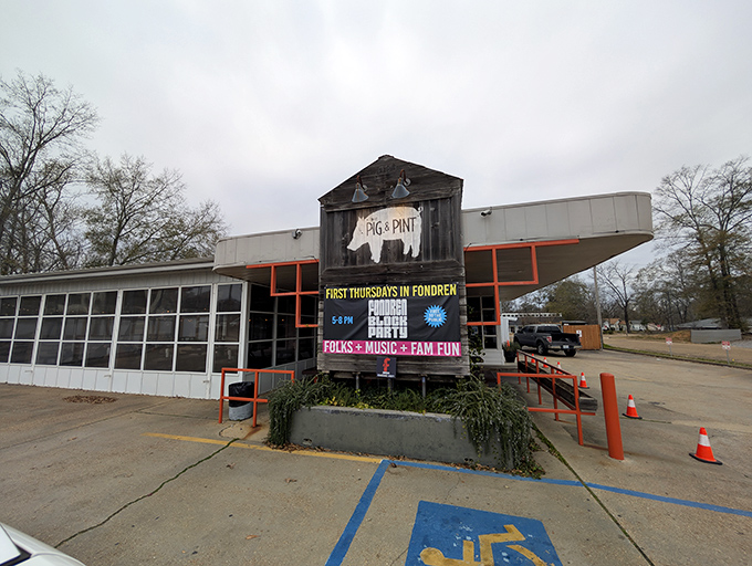 The iconic pig silhouette welcomes barbecue pilgrims to this Fondren district gem, where string lights promise good times ahead.