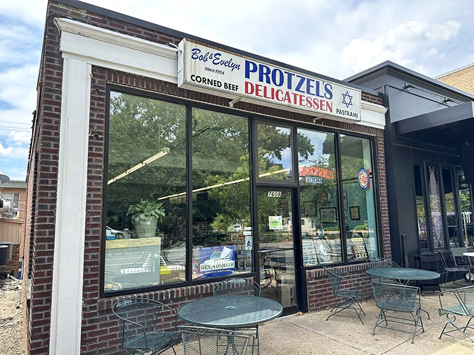 The unassuming storefront of Protzel's Delicatessen stands like a time portal to sandwich nirvana, complete with outdoor seating for those perfect St. Louis afternoons.