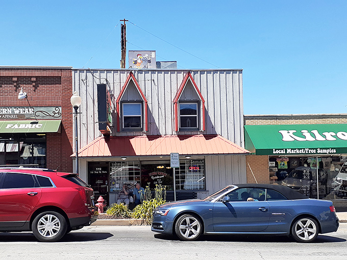 The weathered wood siding and red-trimmed windows aren't trying to impress anyone, yet the line of hungry patrons tells you everything you need to know. 