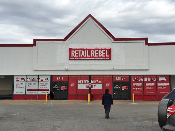 The red-trimmed fa&ccedil;ade of Retail Rebel stands like a beacon of bargain hope against the Missouri sky, promising treasures within for the deal-savvy shopper. 