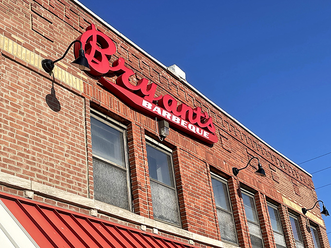 The iconic brick facade and bold red sign of Arthur Bryant's stands as a beacon of barbecue excellence against the Kansas City sky.