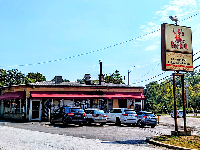 The unassuming exterior with its bright red awning houses barbecue magic that's drawn pilgrims from across Missouri for decades.