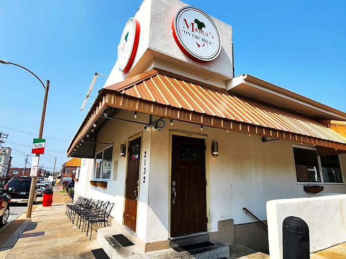 The iconic corner building with its distinctive copper awning stands as a beacon of Italian comfort in St. Louis' historic Hill neighborhood.
