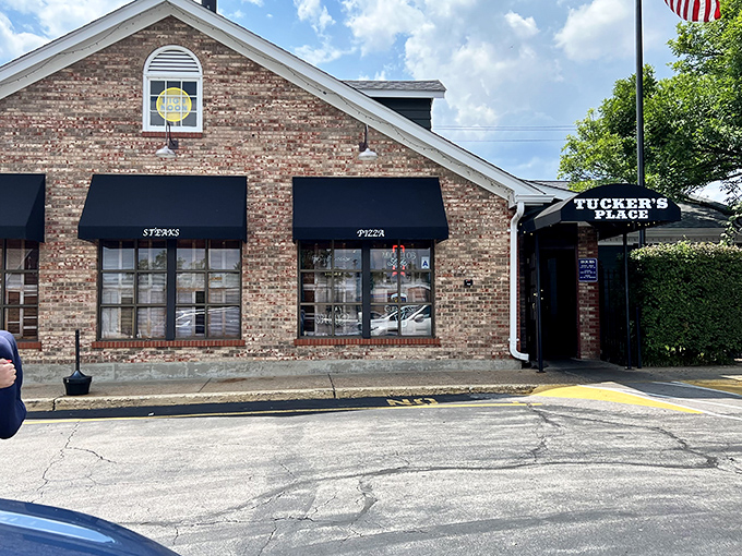 The iconic brick exterior of Tucker's Place glows with welcome in the evening light, a beacon for hungry carnivores throughout Manchester. 
