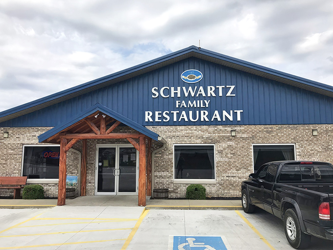 The blue-roofed haven of homestyle cooking stands proudly against an Indiana sky, promising comfort food that'll make your soul sing.