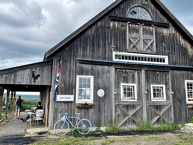 The weathered barn exterior isn't just Instagram-worthy—it's a promise of authenticity. New Hampshire's rolling hills provide the perfect backdrop for this farmstead treasure.