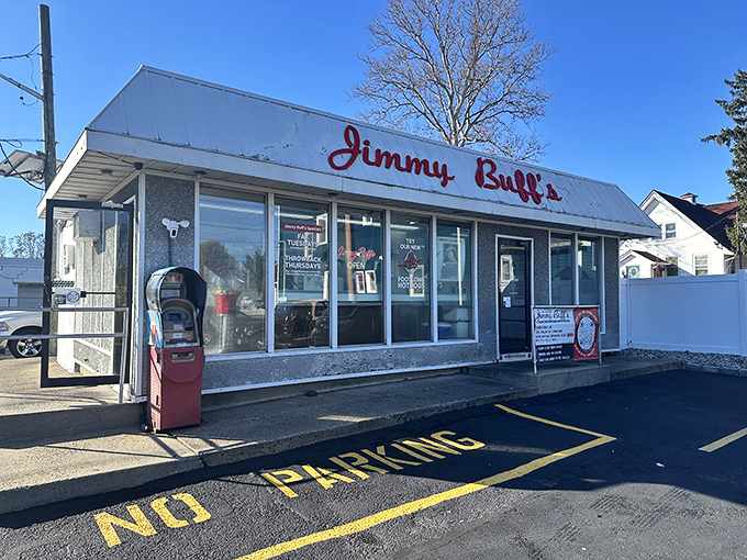 The iconic Jimmy Buff's sign stands sentinel against a perfect blue New Jersey sky, promising Italian hot dog perfection to all who approach.