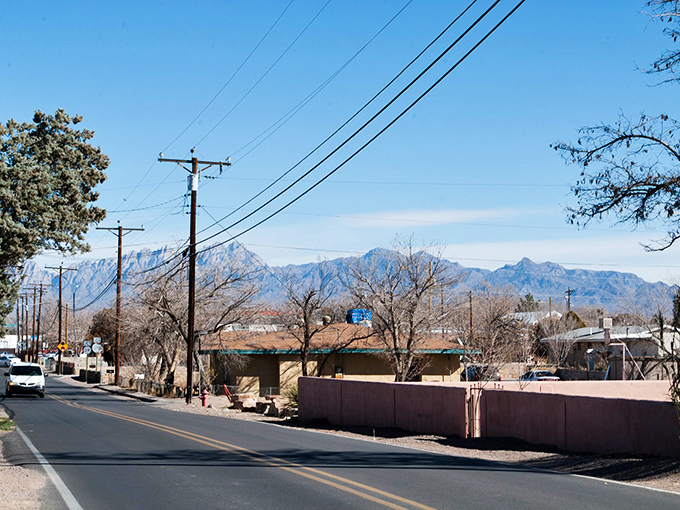 The Organ Mountains create a dramatic backdrop for Mesilla's adobe buildings, like nature's own theatrical curtain for this historic stage.