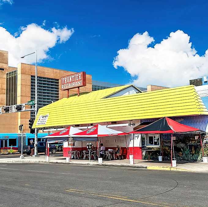 The iconic yellow and red A-frame beckons from Central Avenue like a culinary lighthouse, promising New Mexican treasures inside.