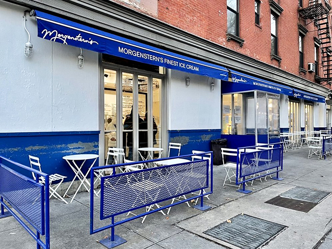 That iconic blue awning against classic New York brick is like a beacon for ice cream pilgrims. Sidewalk seating adds the perfect touch of urban charm.
