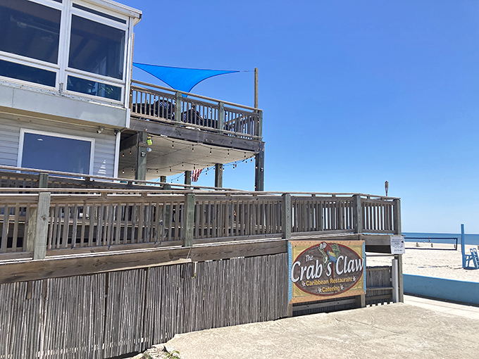 The entrance to paradise isn't pearly gates, but red stairs flanked by tiki totems and colorful flags announcing your arrival at seafood heaven.
