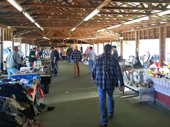 The weekend treasure hunt begins! Shoppers navigate the bustling outdoor section where handmade crafts and fresh finds await discovery.