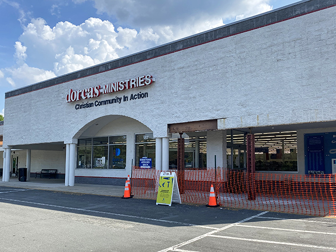 The welcoming fa&ccedil;ade of Dorcas Ministries invites treasure hunters with its clean white exterior and clear signage about donation procedures and store hours.