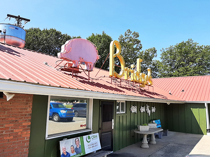 The vintage neon sign beckons like a barbecue lighthouse, guiding hungry travelers to this unassuming temple of smoke and tradition since 1946.