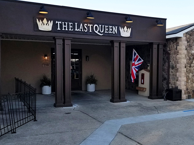 The Last Queen stands proudly in Enon, its stone facade and British flag promising an authentic pub experience that feels worlds away from Ohio cornfields.