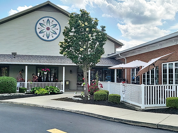 The sunset glow on Der Dutchman's wraparound porch feels like a warm-up act for the comfort food main event waiting inside.