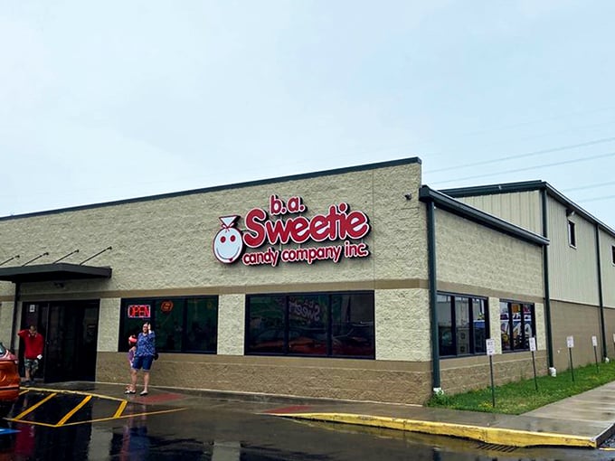 That iconic red signage against the cream-colored building is like a beacon for your inner child. Sweeties Candy Company stands ready to fulfill sugar-coated dreams.