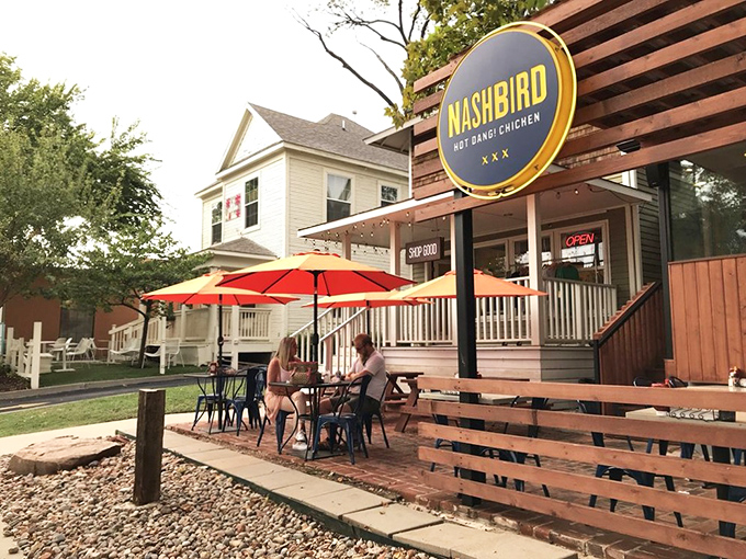 NASHBIRD's charming converted house exterior beckons with its wooden deck and bright signage&mdash;like a Southern porch that happens to serve life-changing chicken.