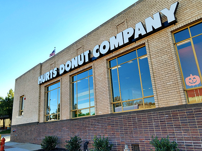 The unassuming brick exterior of Hurts Donut Company hides a kaleidoscope of sugary treasures within. Yellow trim hints at the colorful experience awaiting inside.