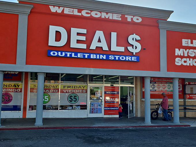 The bright red storefront of Deals Outlet Bin Store stands out like a beacon of bargain hope on SW 59th Street. Treasure hunting begins here!