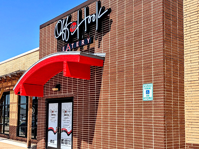 The bright red signage against tan brick promises seafood salvation in a landlocked state. Oklahoma's coastal embassy awaits.