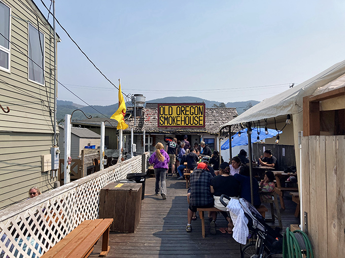 The yellow door beckons like a coastal lighthouse. This weathered shack with its bold sign promises seafood treasures that fancy restaurants can only dream about.