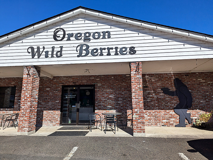 The brick-and-white exterior of Berry Patch Restaurant stands like a beacon of comfort food promise against Oregon's blue skies.
