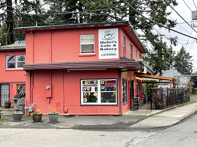 Welcome to flavor town! Mehri's Cafe & Bakery's cherry-red exterior is like a beacon for hungry souls in Portland.