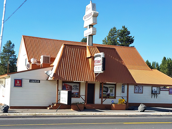 The copper-topped A-frame roof of Mohawk Restaurant stands like a rustic beacon for hungry travelers on Highway 97, complete with patriotic flair. 