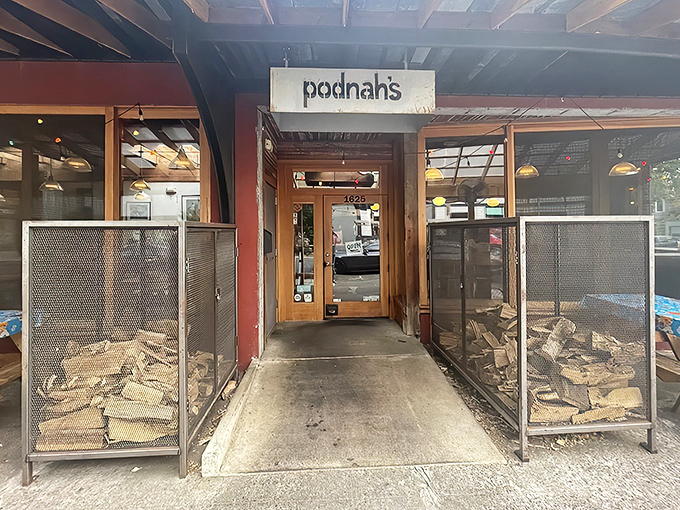 The entrance to barbecue nirvana, flanked by wood cages that aren't just decoration&mdash;they're the secret behind that intoxicating smoke aroma wafting through the neighborhood.